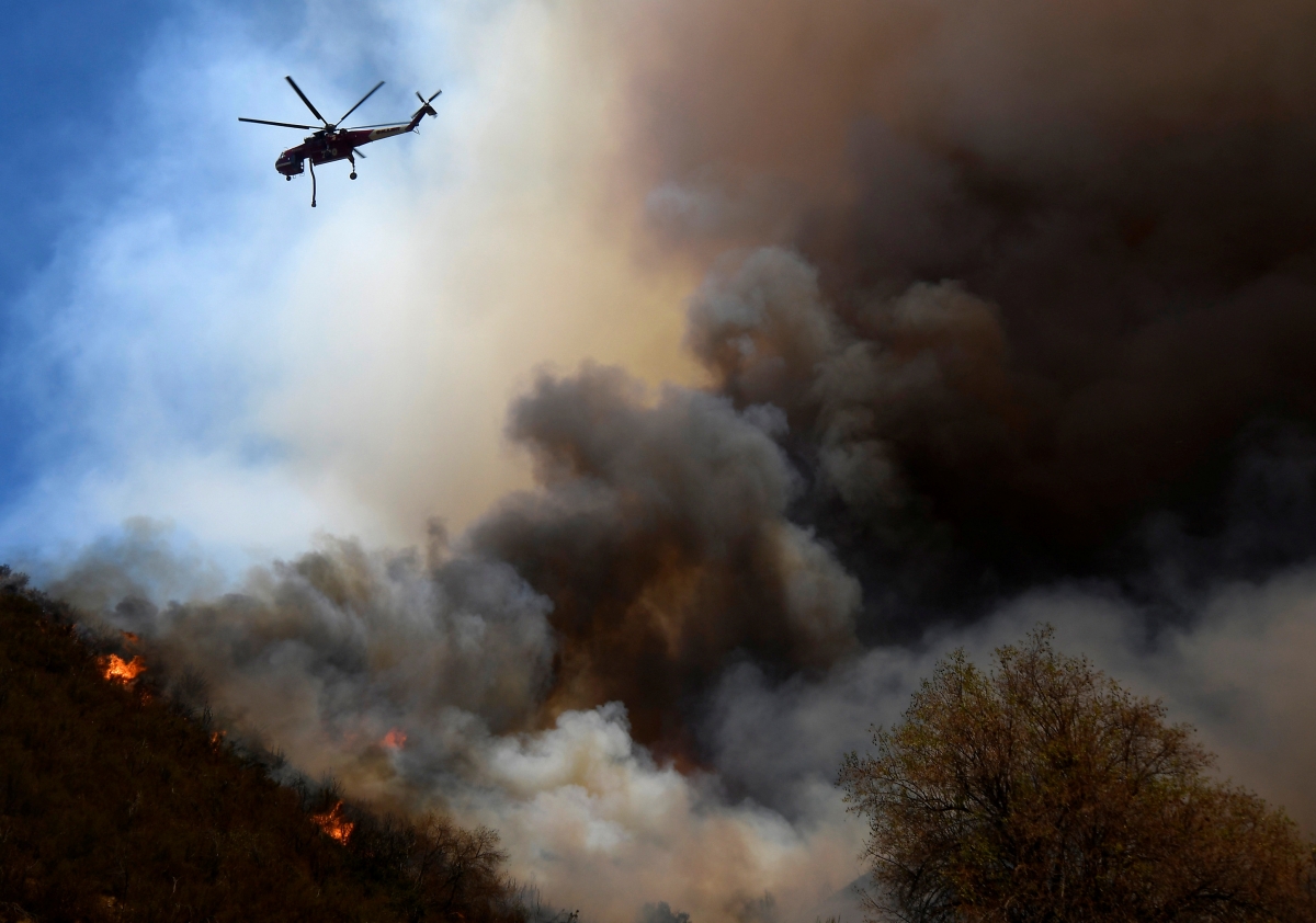 Fire fighters battle the Sand Fire in the Angeles National Forest near ...