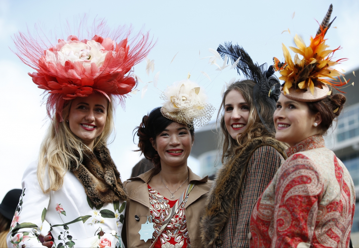 Racegoers celebrate on the ladies day at Cheltenham Festival